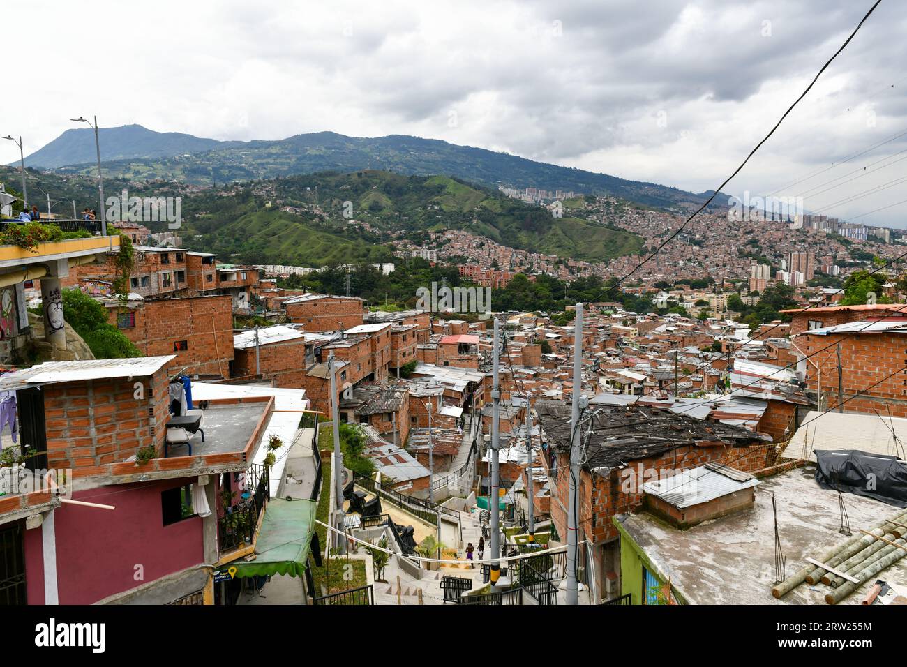 Colorful streets of Comuna 13 district in Medellin, Colombia, a former ...