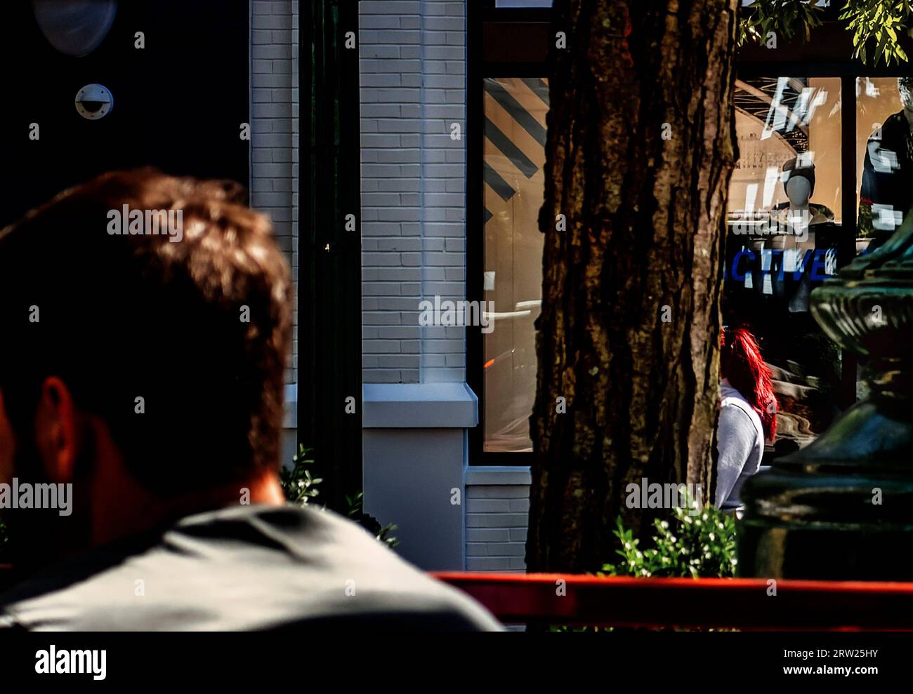 Looking into a shop window from a distance Stock Photo - Alamy