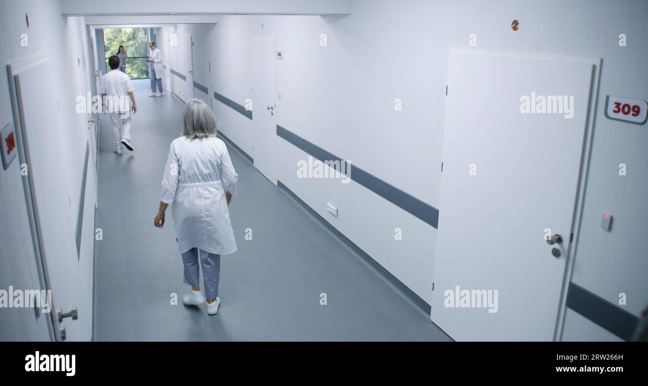 Bright clinic corridor busy doctors hi-res stock photography and images ...