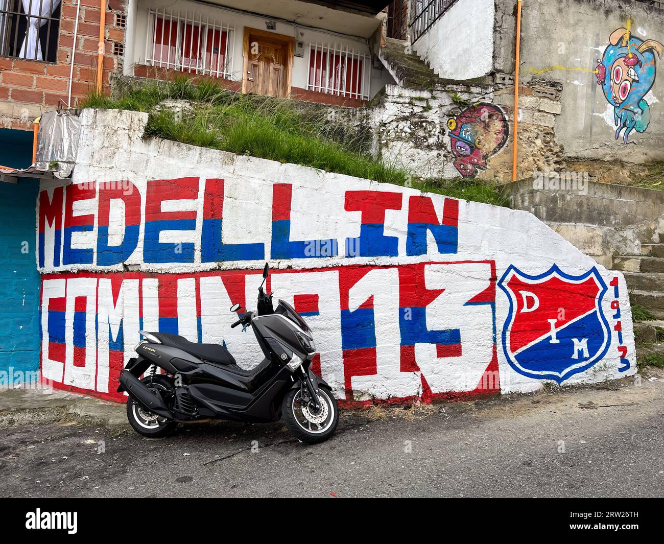 Colorful streets of Comuna 13 district in Medellin, Colombia, a former ...