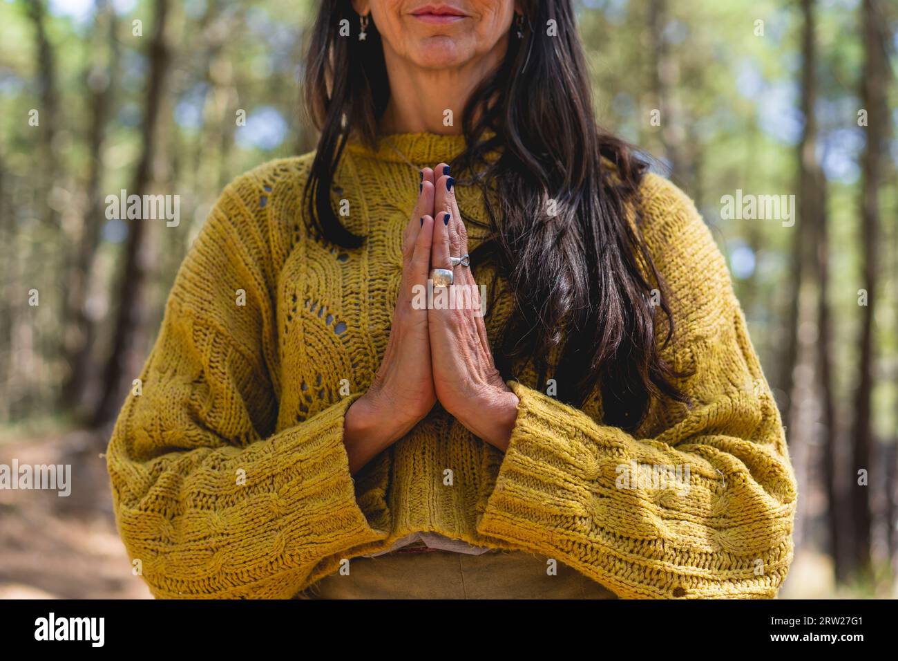 Woman clasping hands hi-res stock photography and images - Alamy