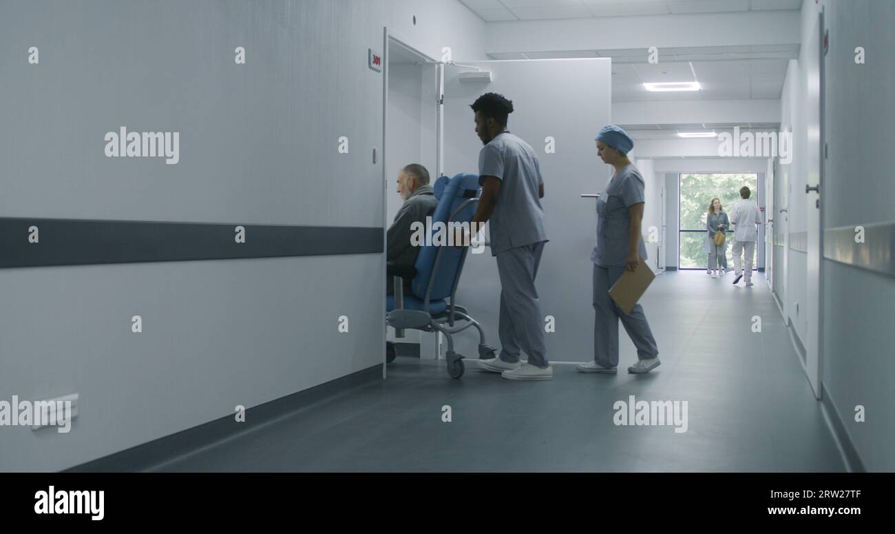 Young nurse opens door to medical office with key card. African ...