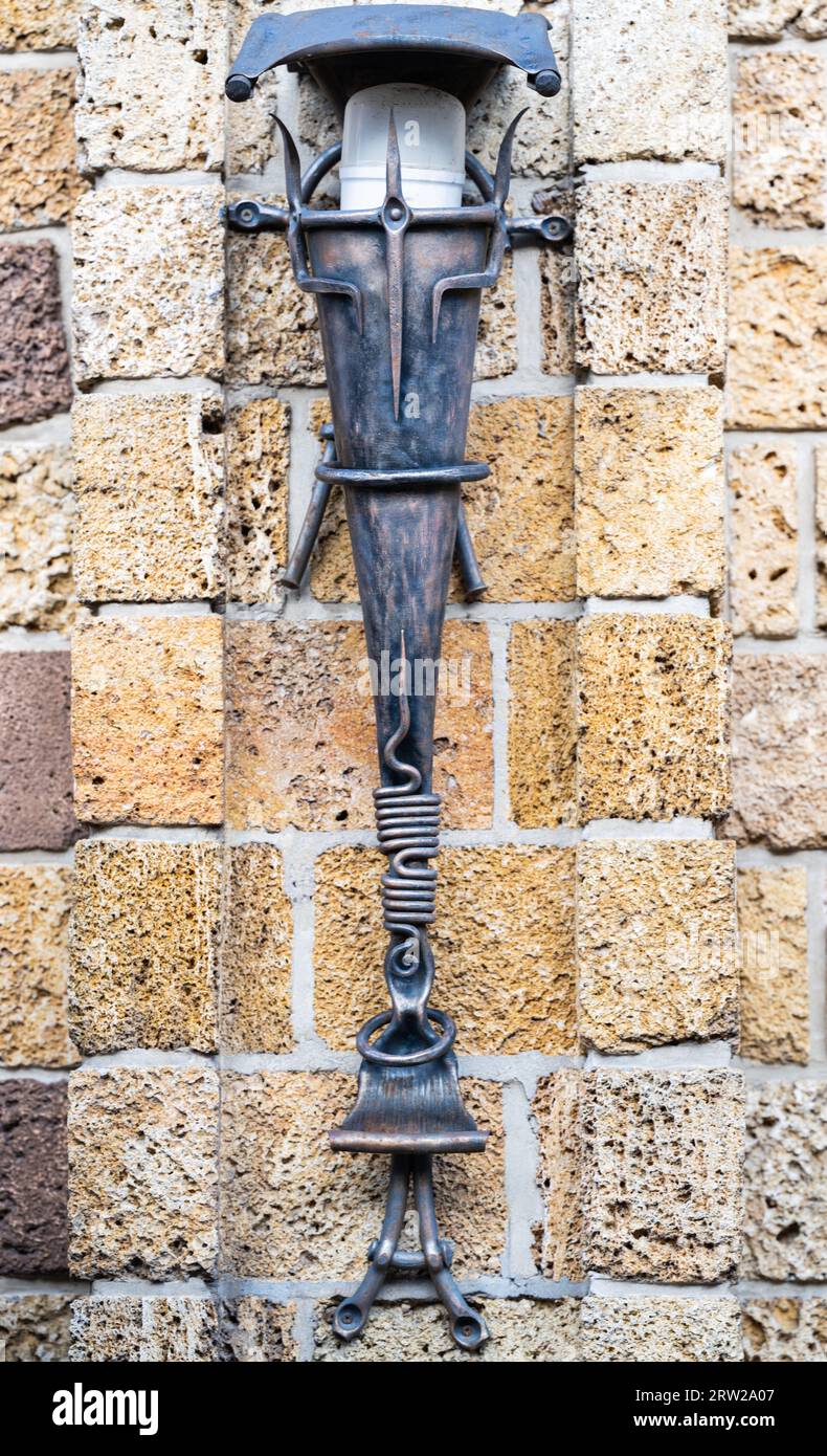 vintage torch on stone wall Stock Photo - Alamy