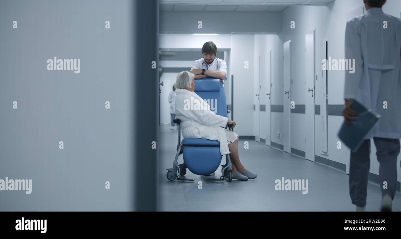 Male doctor stands elderly woman hi-res stock photography and images ...