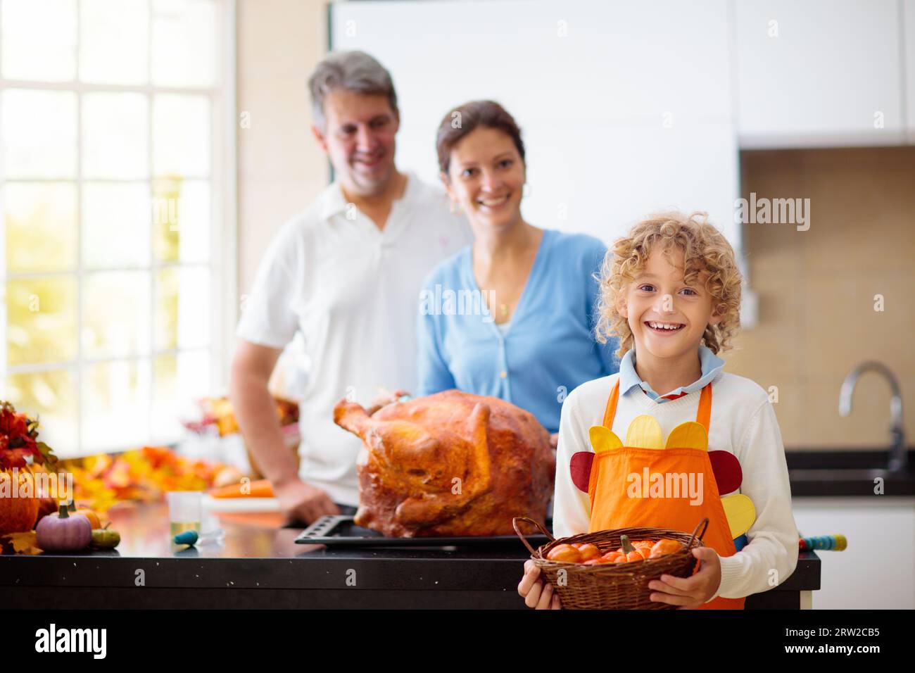 Turkey for Thanksgiving. Family cooking festive dinner. Mother, father ...