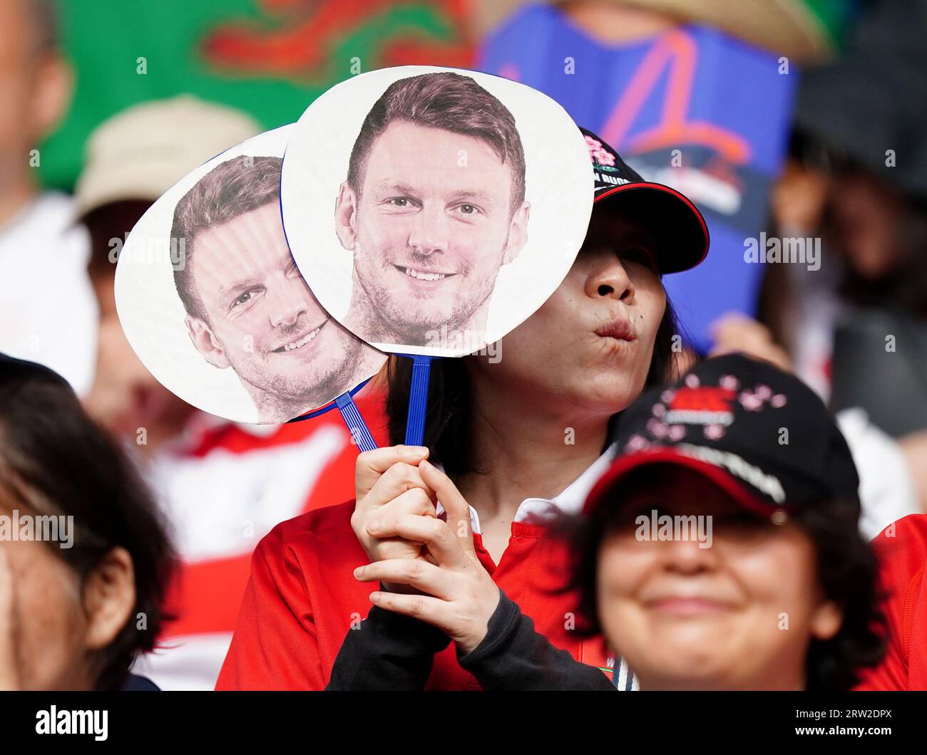 A Wales fan in the stands holds up a Dan Biggar picture ahead of the ...