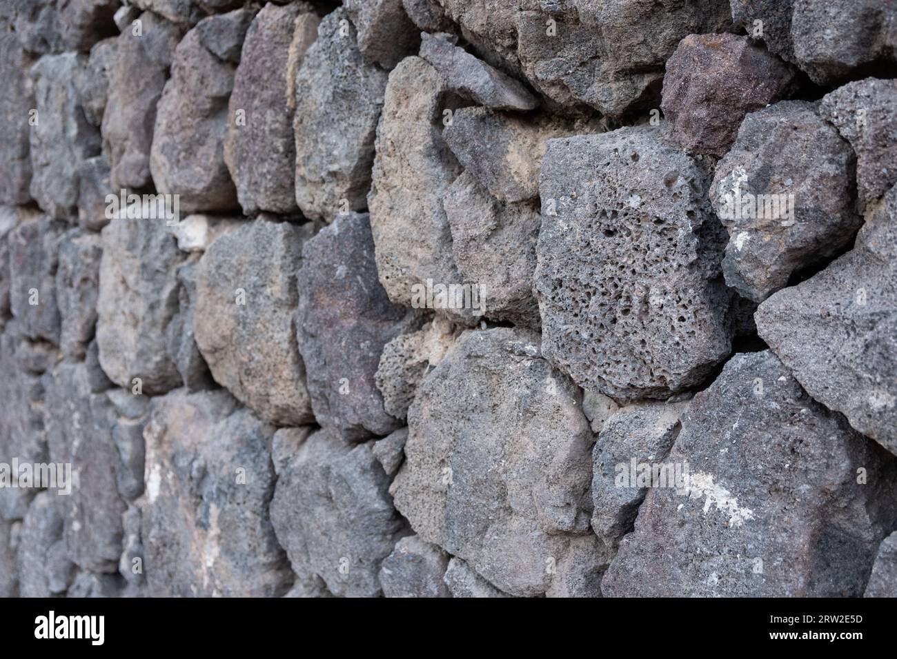 volcanic rock wall construction Stock Photo - Alamy