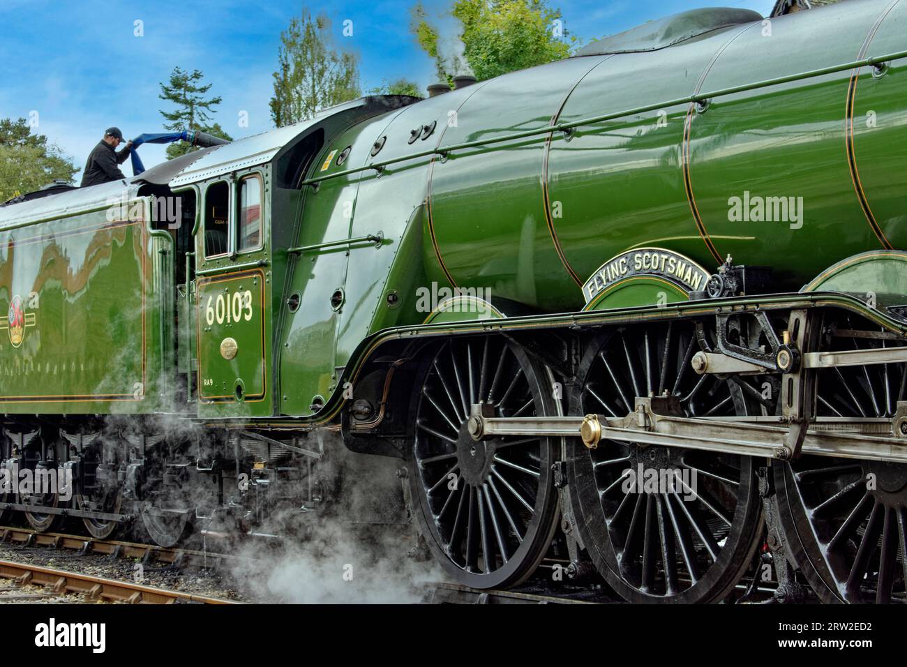 Flying Scotsman Steam Train taking on water at Boat of Garten Station ...