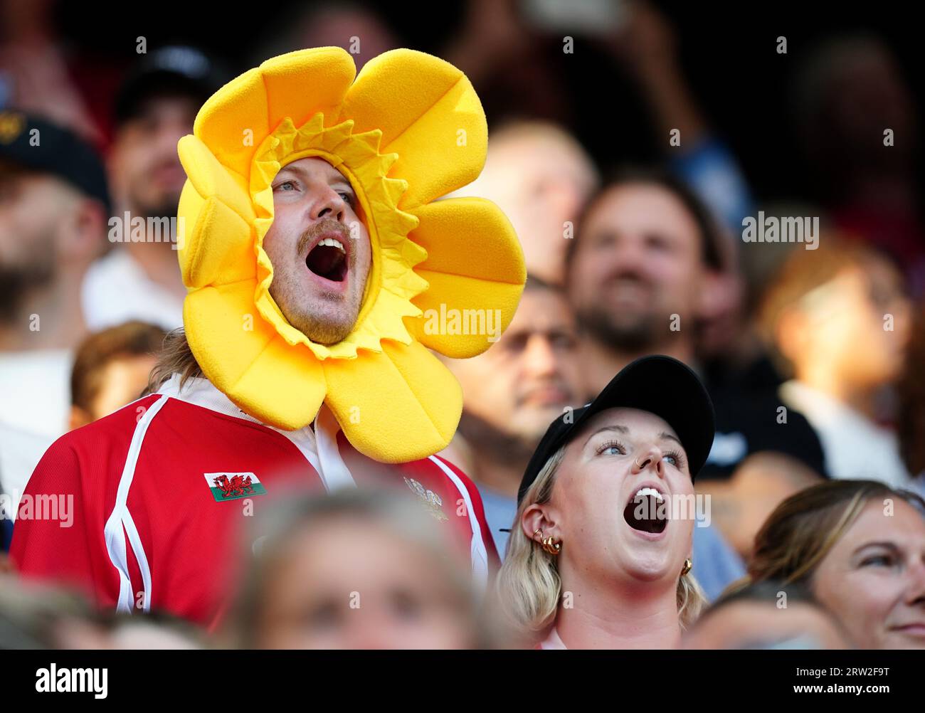 Wales fans in the stands sing their national anthem ahead of the Rugby ...