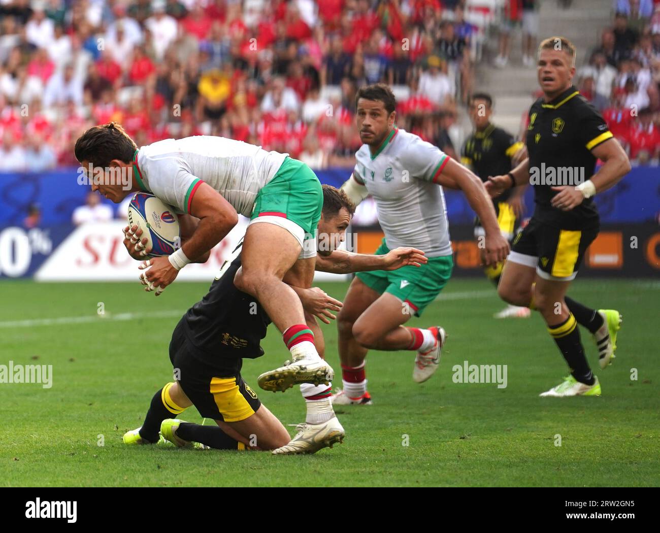 Portugal's Tomas Appleton tackled by Wales' Tomos Williams during the ...