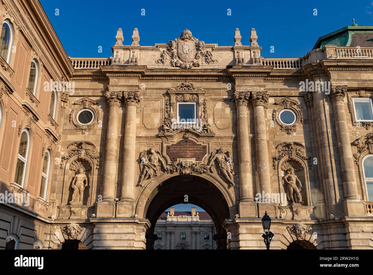 A picture of an ornate gateway at the Buda Castle, leading to the Lion ...