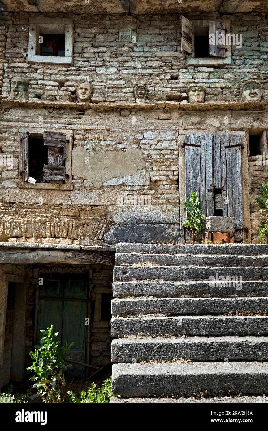 Village of Cerna: the stone facade of the ancient house with the ...