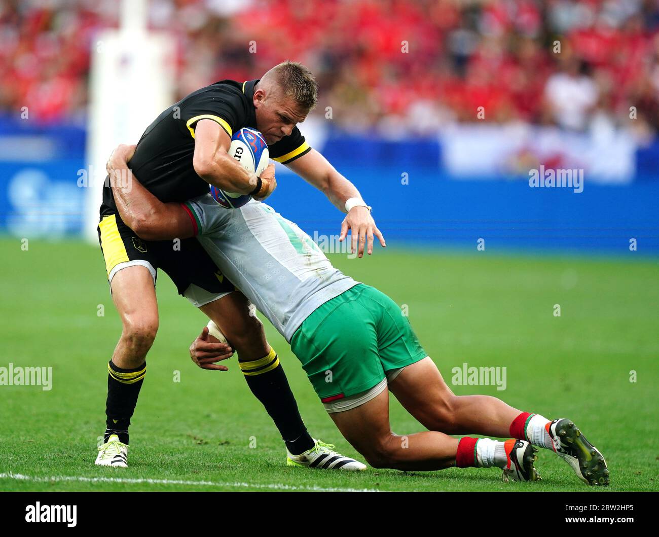 Wales' Gareth Anscombe tackled by Portugal's Jose Lima during the Rugby ...