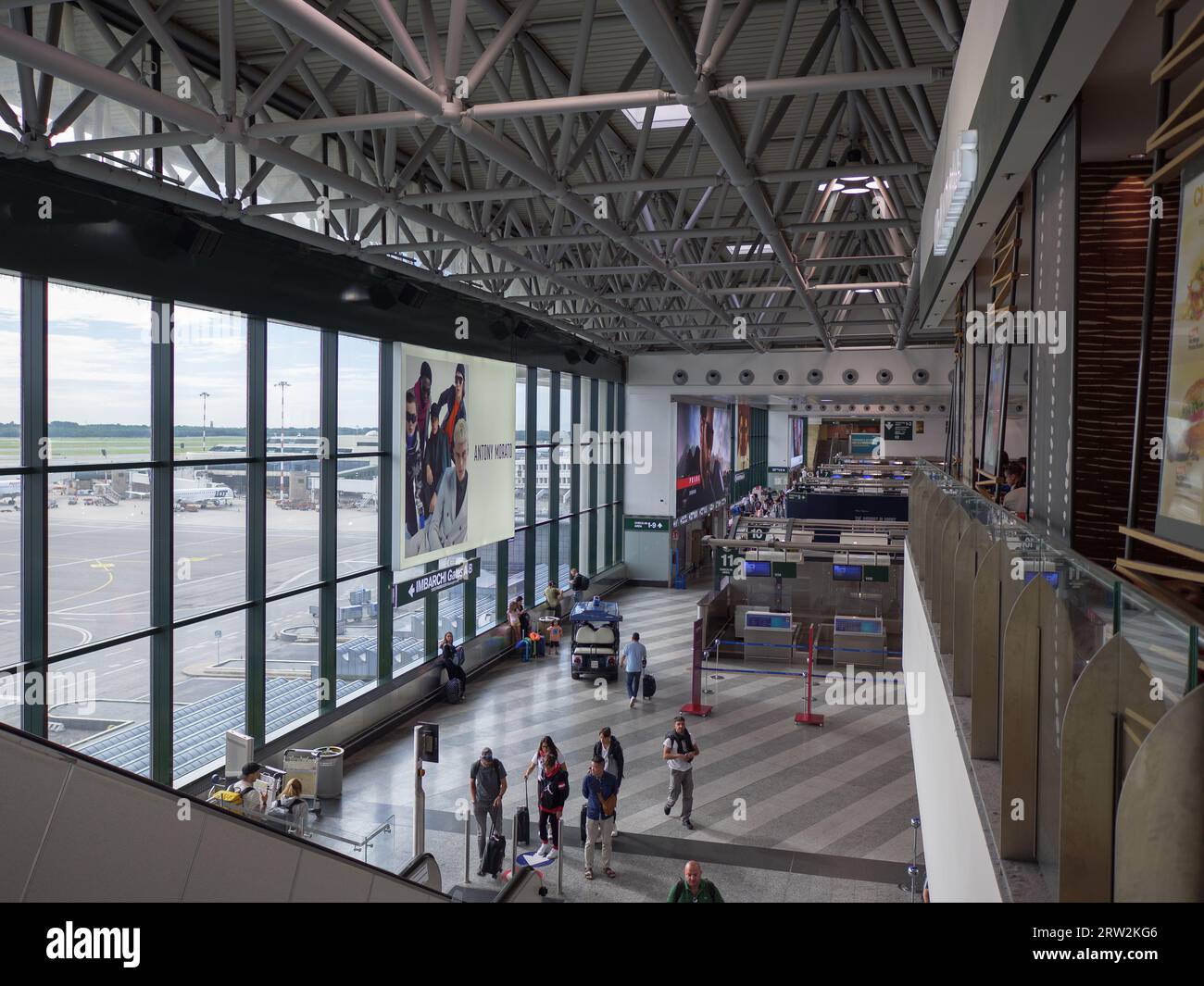 Passengers Inside the Milan Malpensa Airport Facility in Italy Stock ...