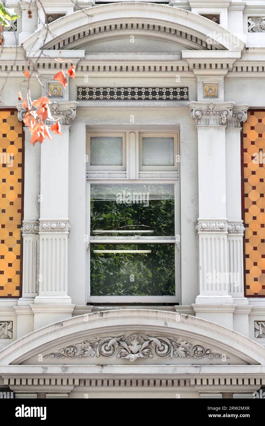 939 Window decorated in Victorian Classical style on the facade over ...