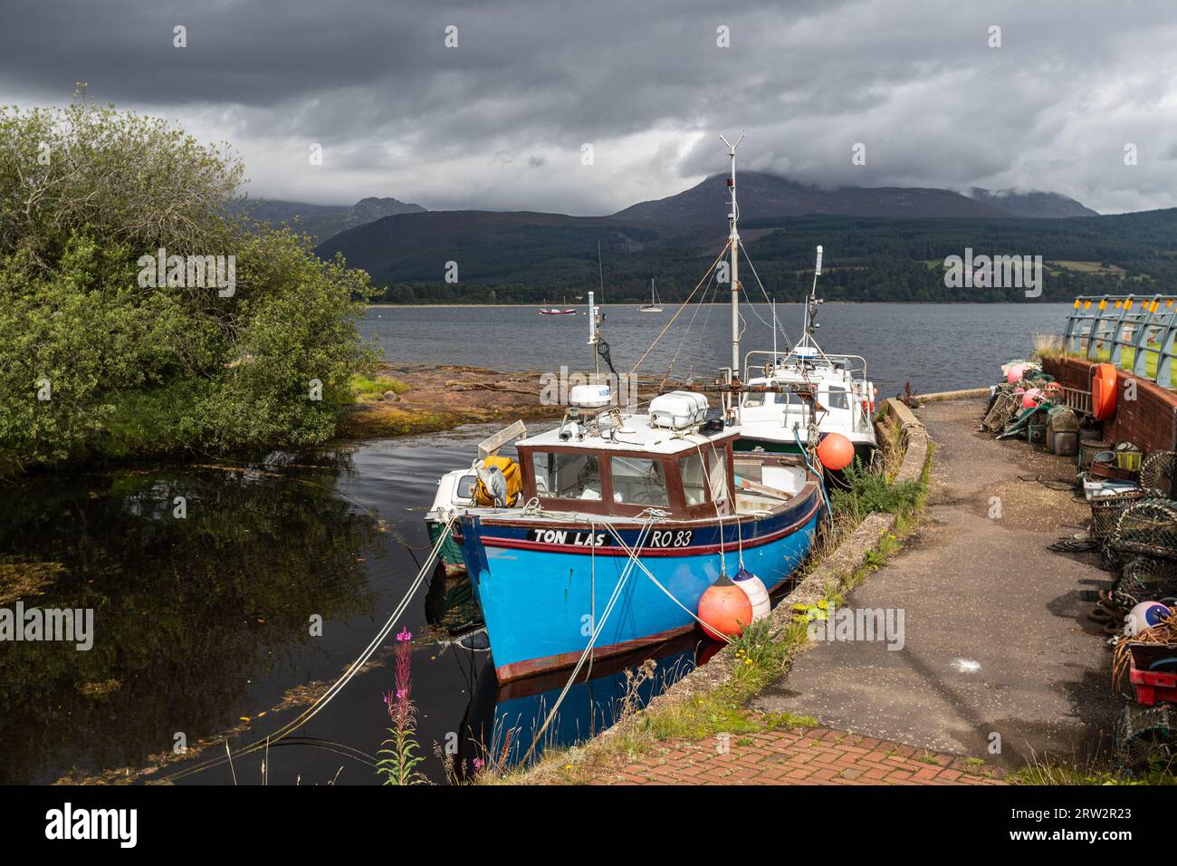 Ton Las ro83 fishing vessel and grey heron, Brodick, Isle Of Arran ...