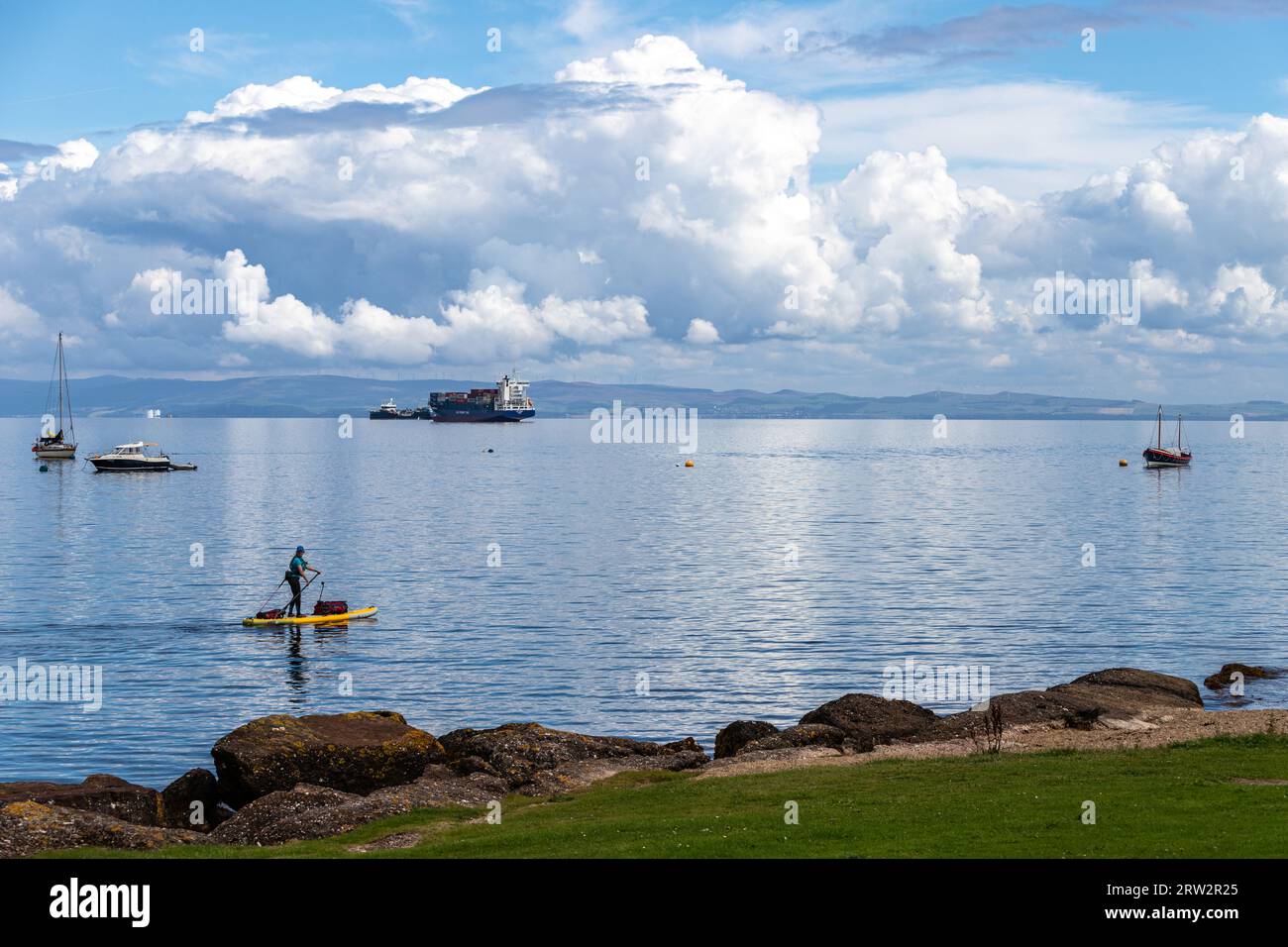 Woman water paddling Isle Of Arran, Firth of Clyde, Scotland, UK Stock ...