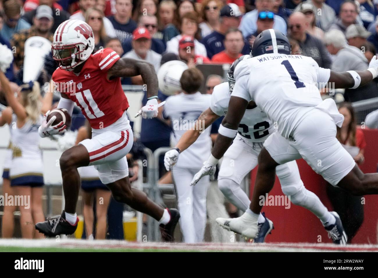 Wisconsin's Skyler Bell (11) runs after a catch during the first half ...