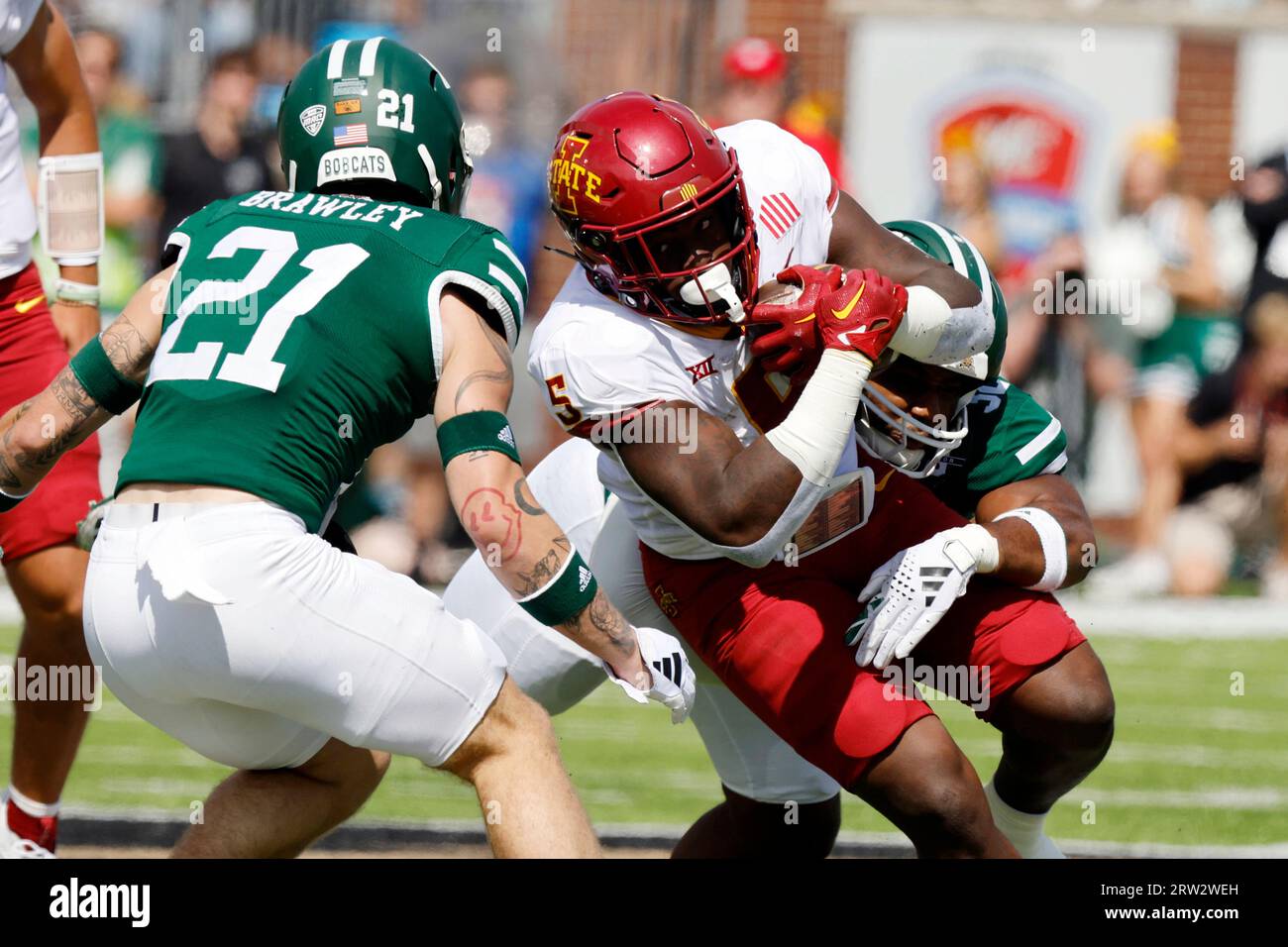 Iowa State running back Cartevious Norton, center, is stopped by Ohio ...