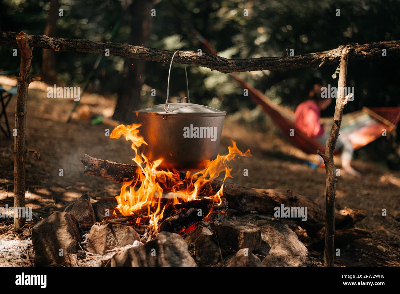Cooking dinner over camp hi-res stock photography and images - Alamy