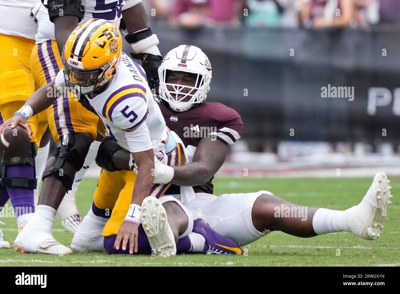 LSU quarterback Jayden Daniels (5) is sacked by Mississippi State ...