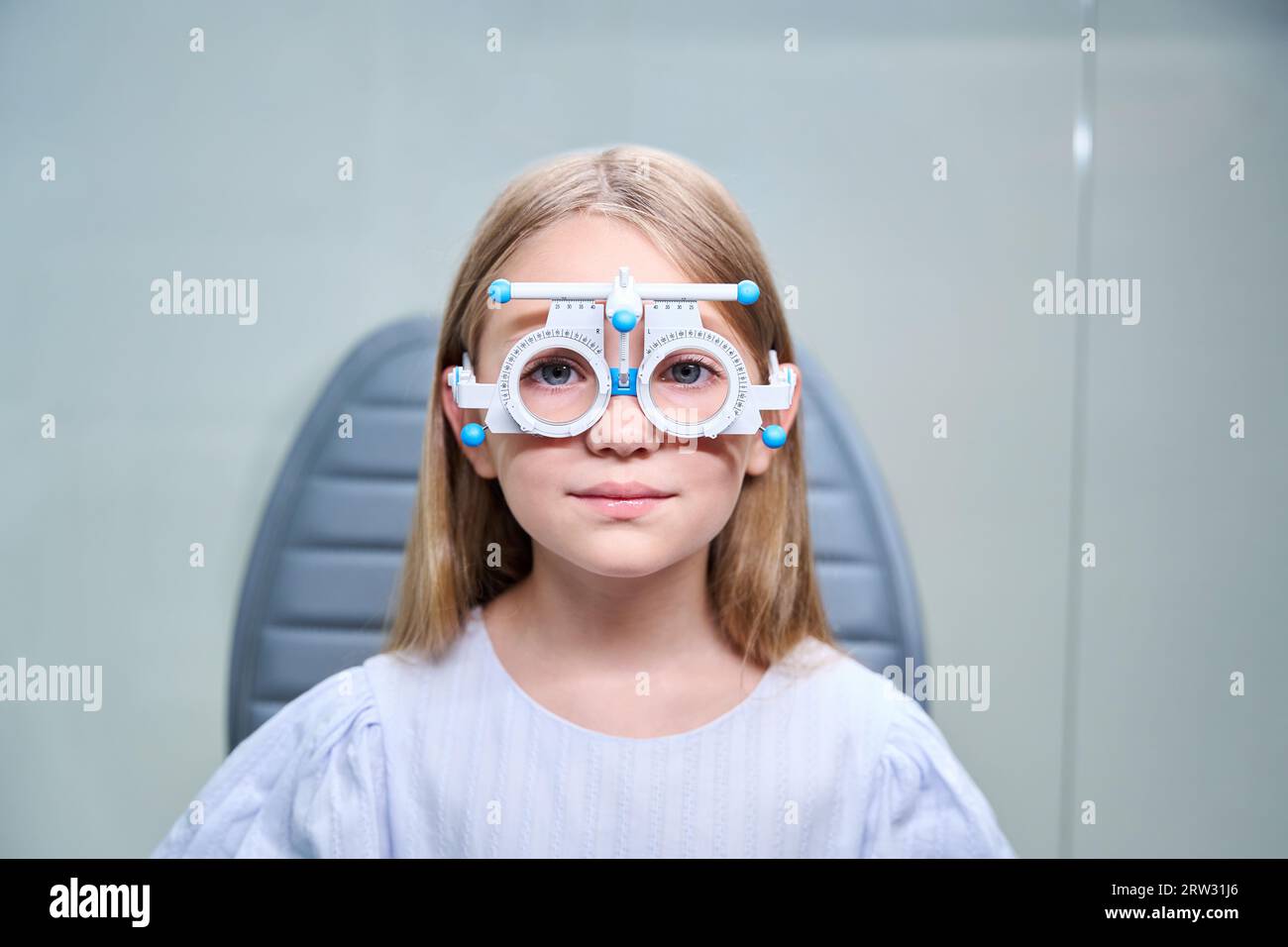 Calm young patient taking eye refraction test Stock Photo - Alamy