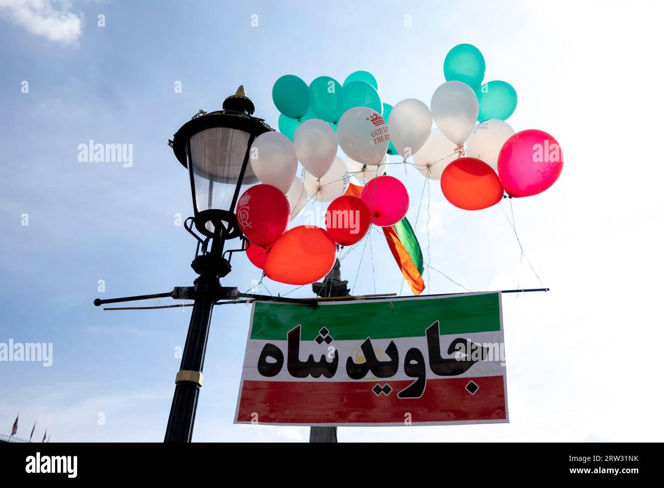 Balloons representing the colour of Iran and slogan in Persian are seen ...