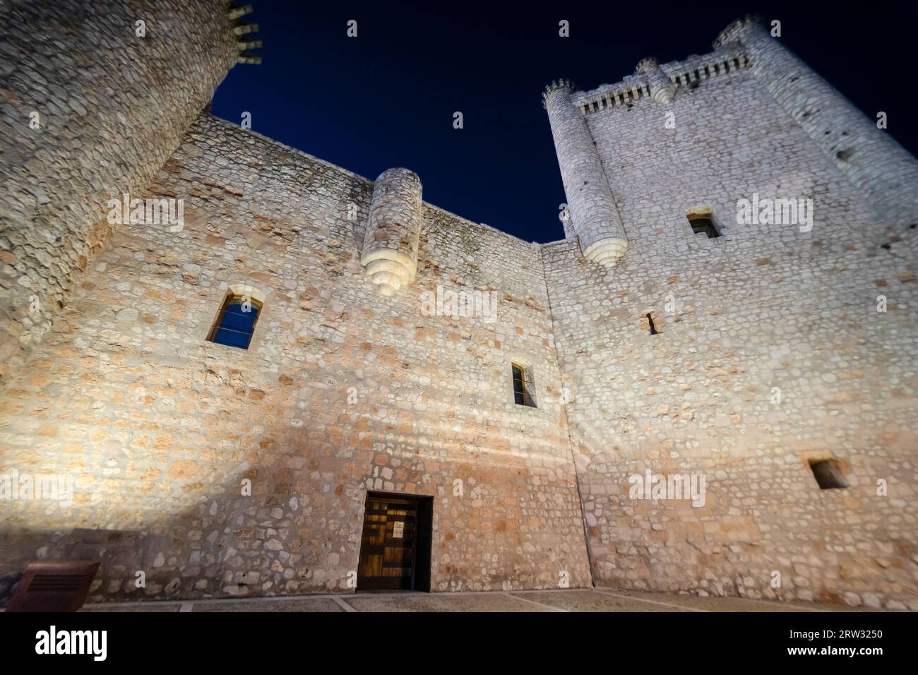 Torija Castle illuminated at night. Close-up view of the castle of ...