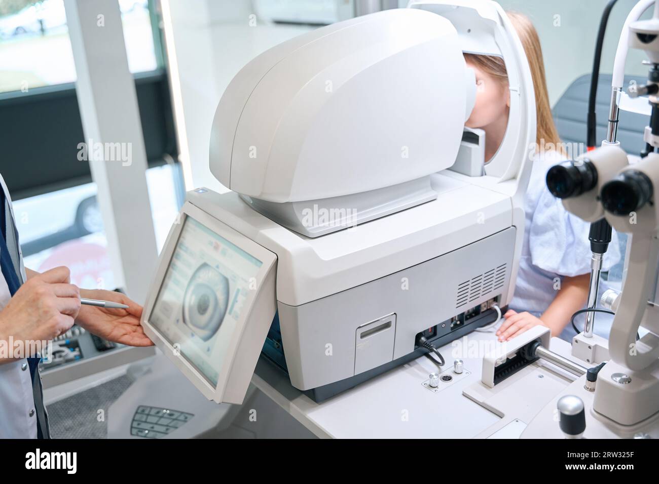 Optometrist determining patient eyeglass prescription using ...