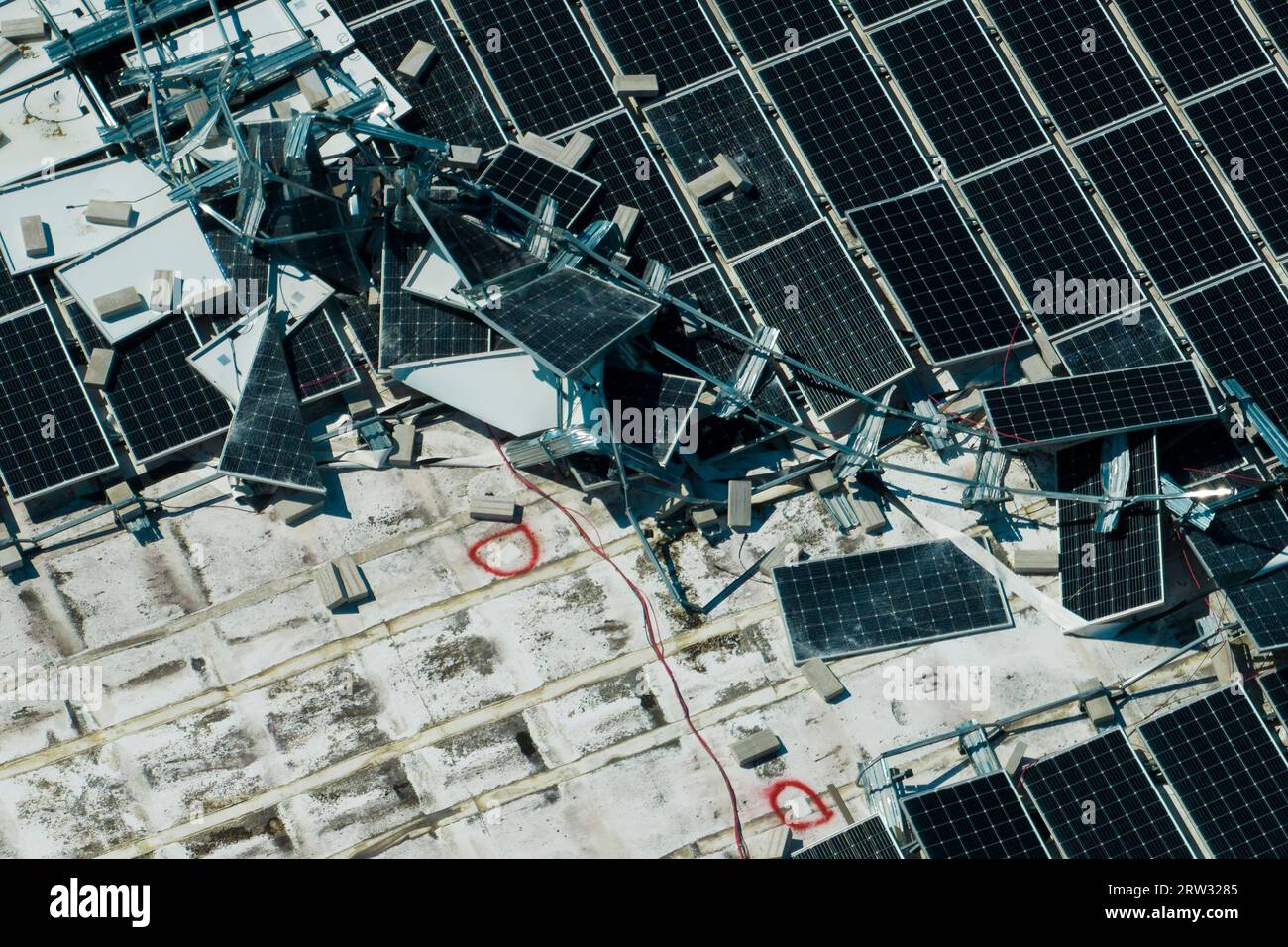 Aerial view of damaged by hurricane wind photovoltaic solar panels ...