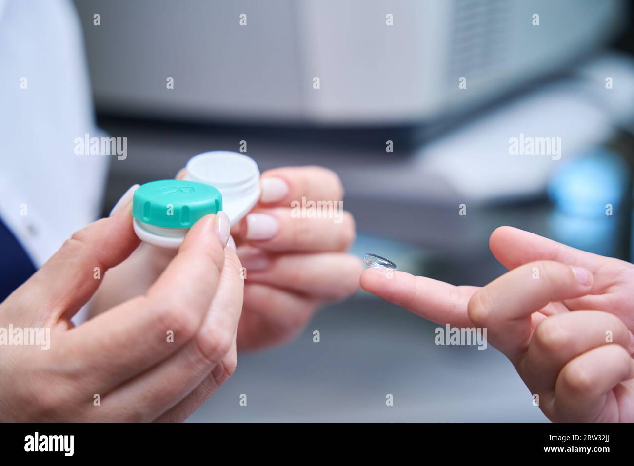 Client learning how to insert ophthalmic lenses in eye doctor presence ...