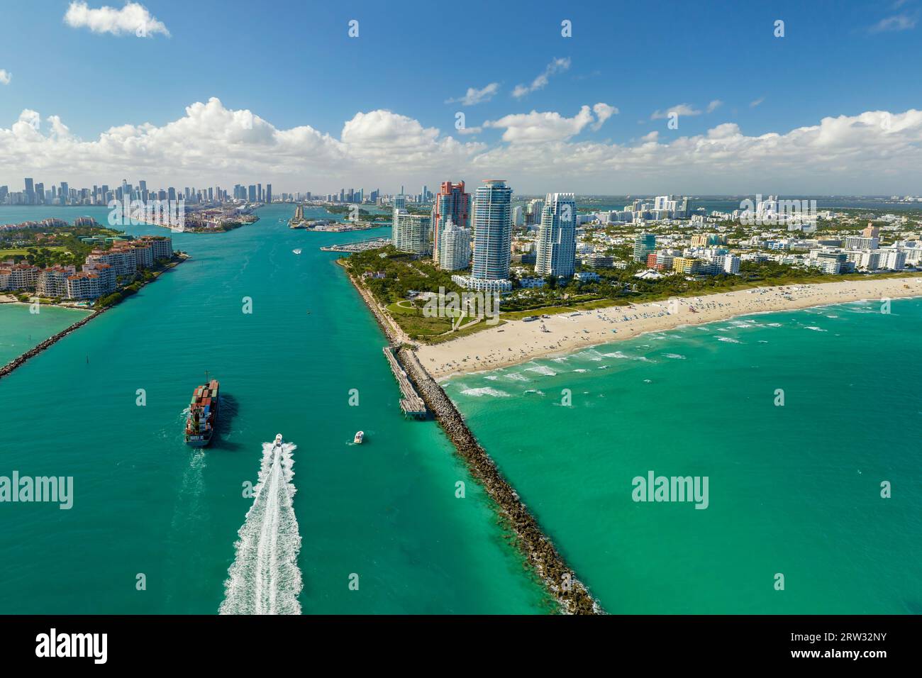 Aerial view of container ship entering in Miami harbor main channel ...
