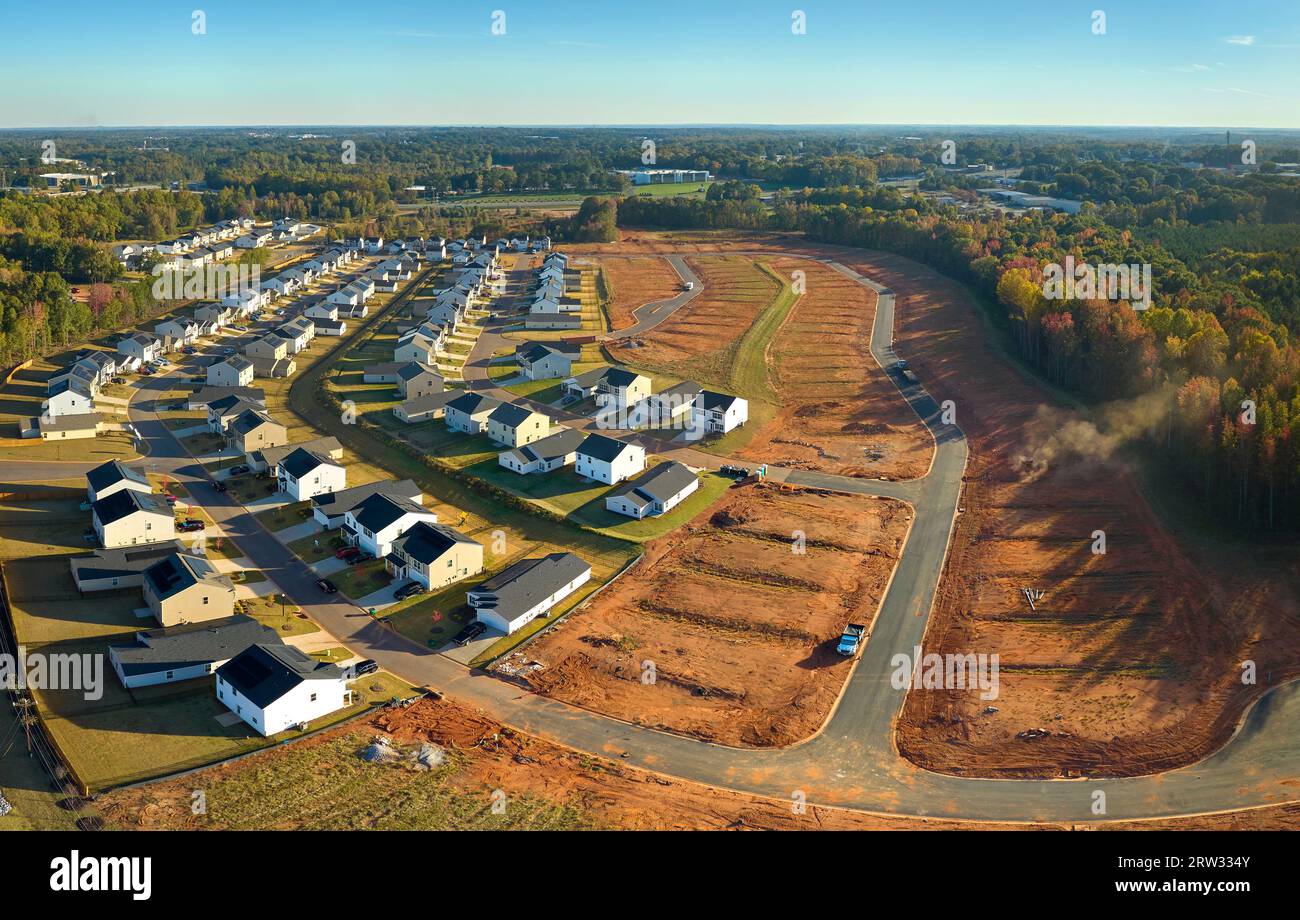 Aerial view of real estate development with tightly located family ...