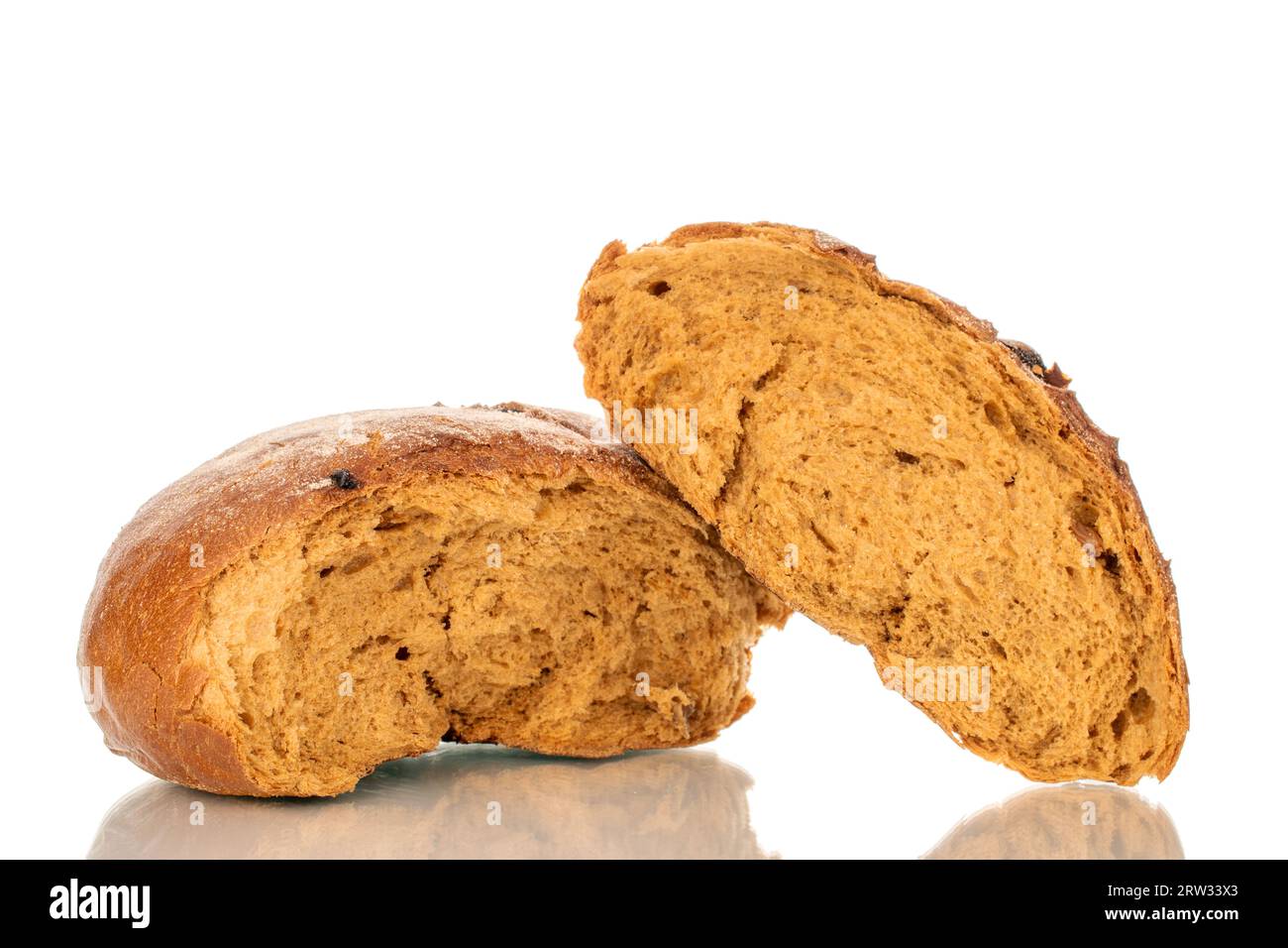 Loaf of bread broken in half with raisins, macro, isolated on white ...