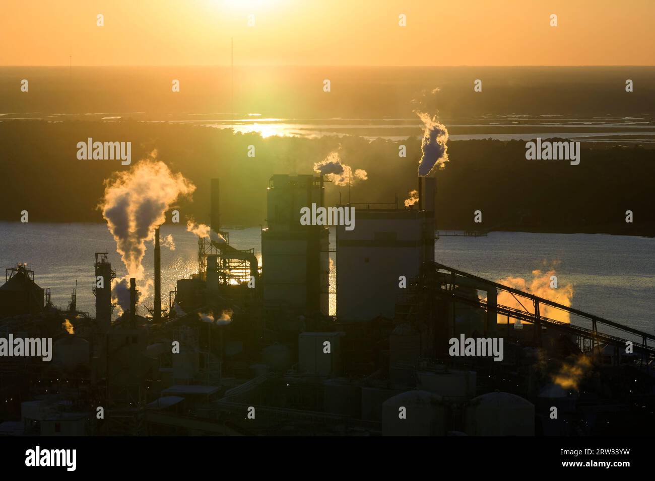 Aerial view of wood processing factory with smoke from production ...