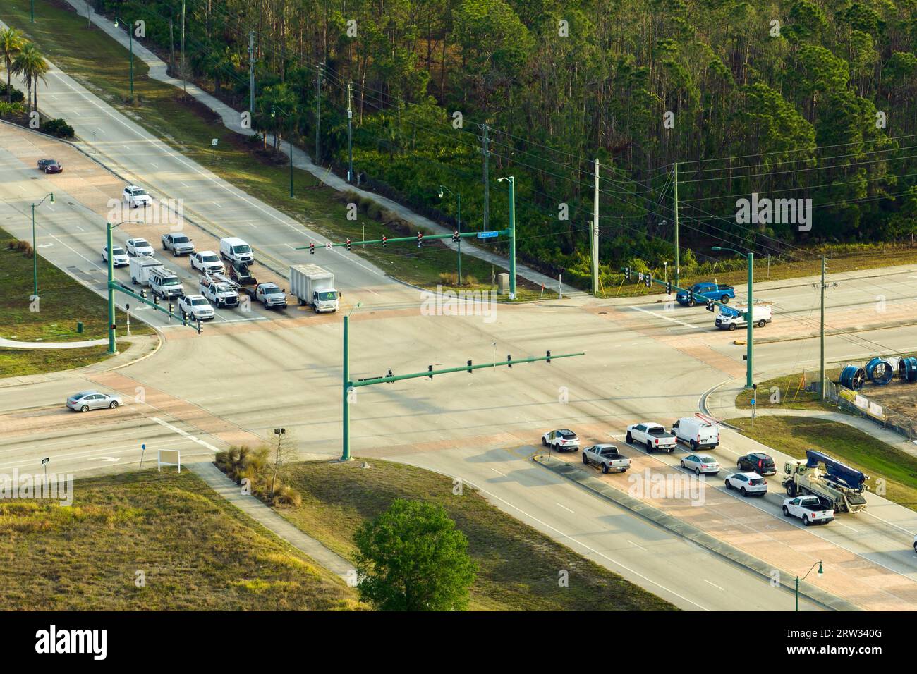 Aerial view of wide multilane road with moving cars at intersection ...
