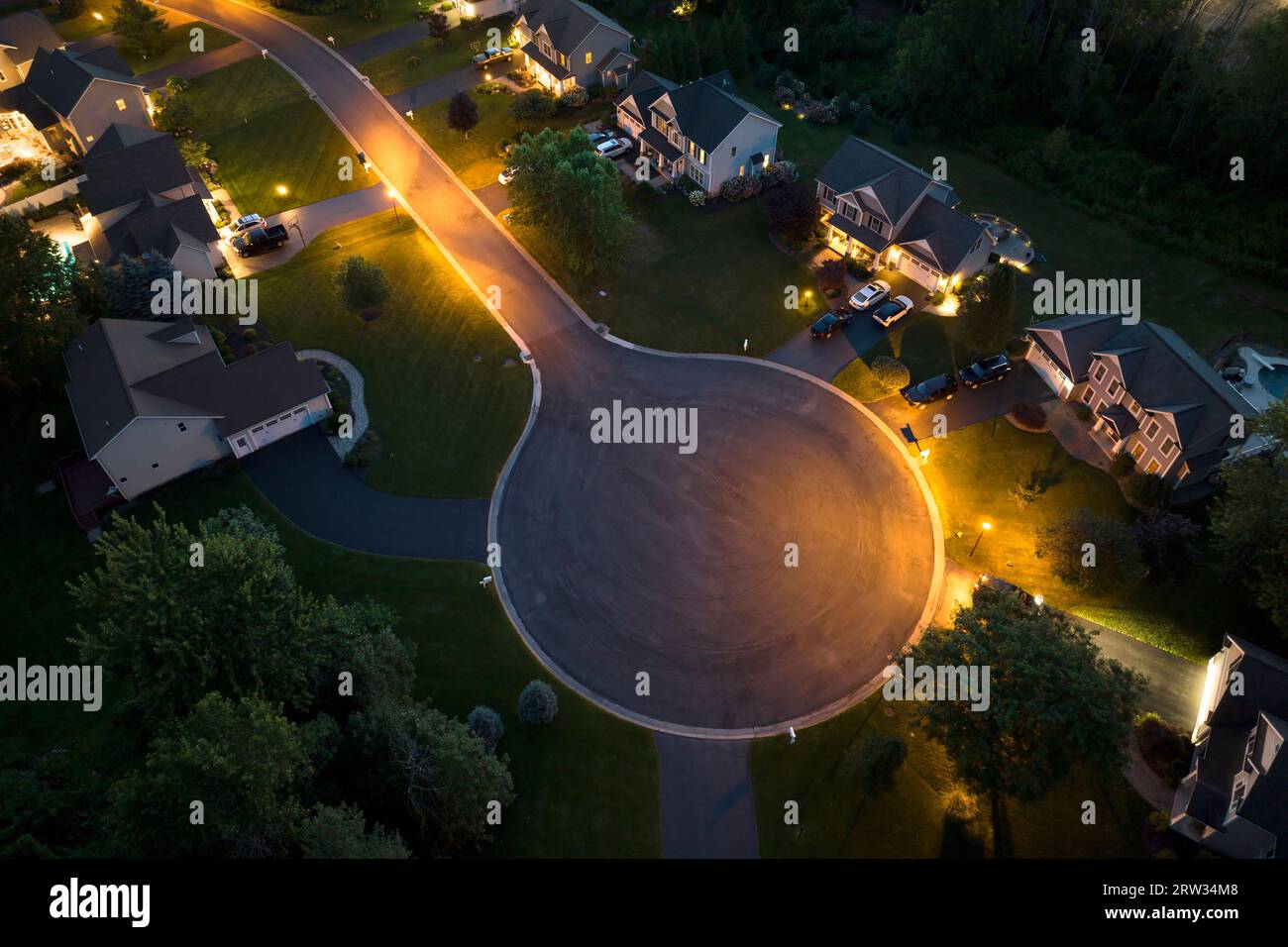 Cul de sac street dead end at night and private residential houses in ...