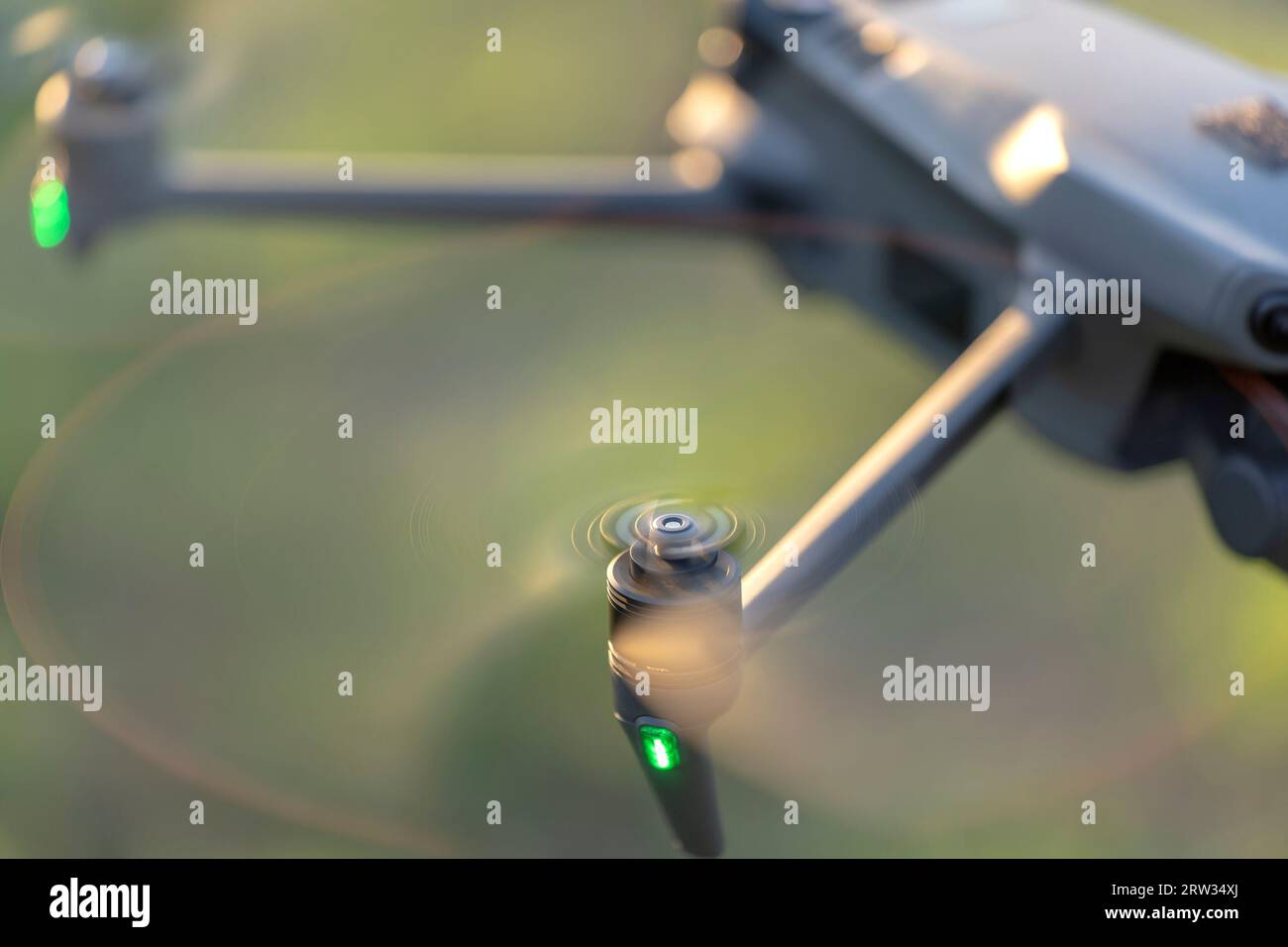 Drone quadcopter with digital camera and fast rotating propellers ...