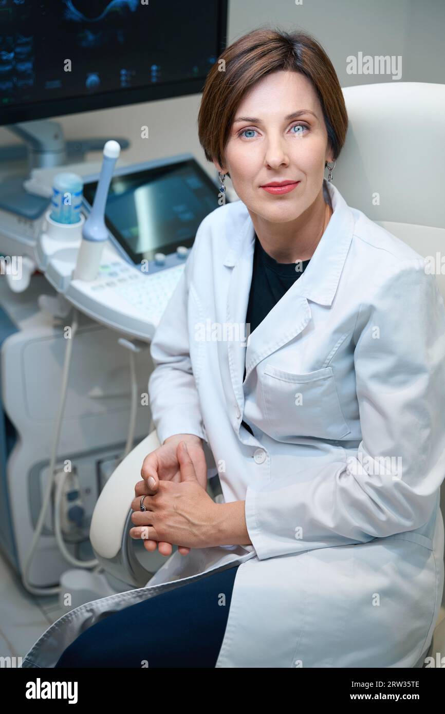 Doctor uses medical machine close hi-res stock photography and images ...