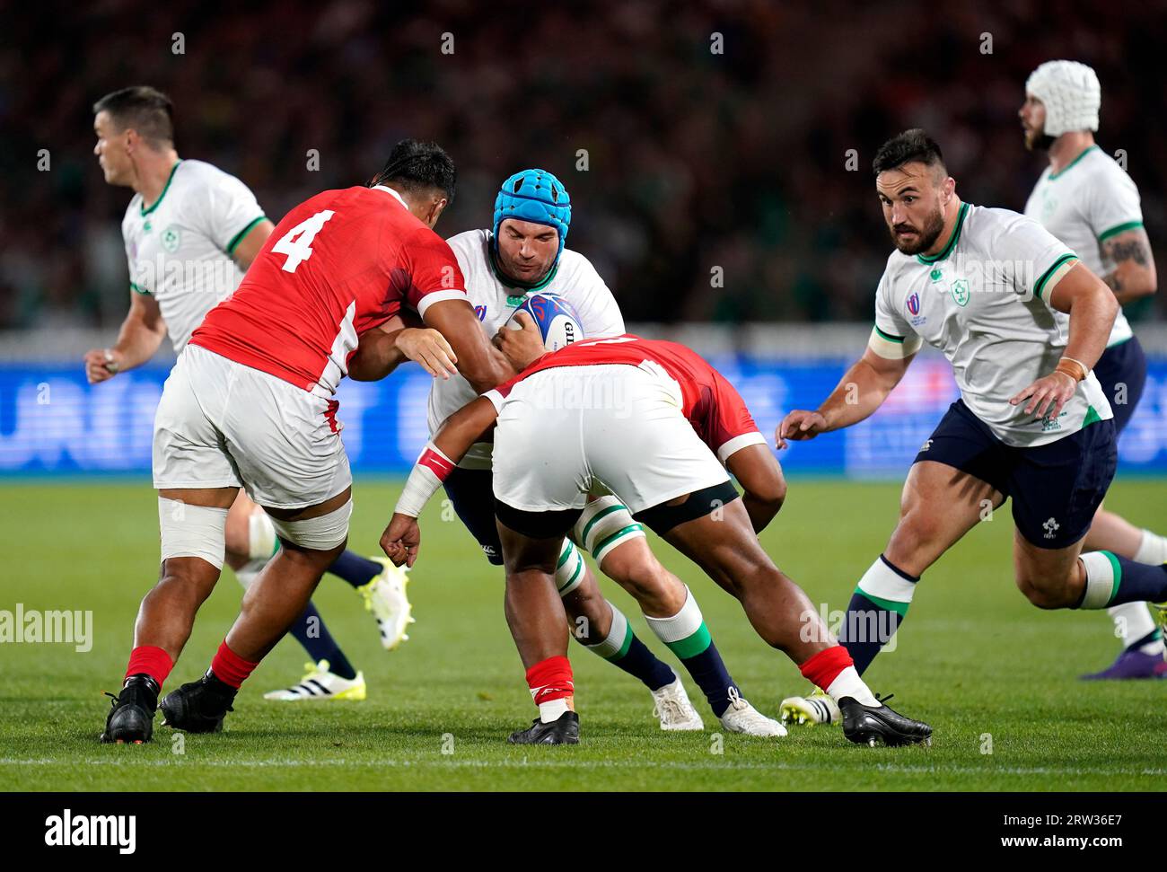 Ireland's Tadhg Beirne tackled by Tonga's Sam Louisi and Paula Ngauamo ...