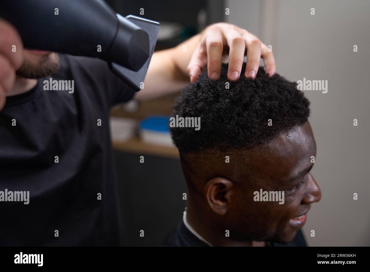 Professional stylist dries hair dryer hi-res stock photography and ...