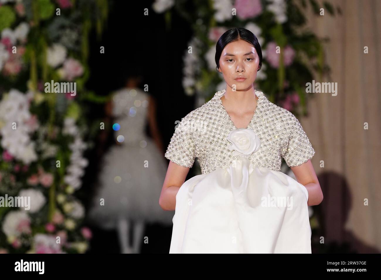 Models on the catwalk during the Richard Quinn show at Andaz London ...