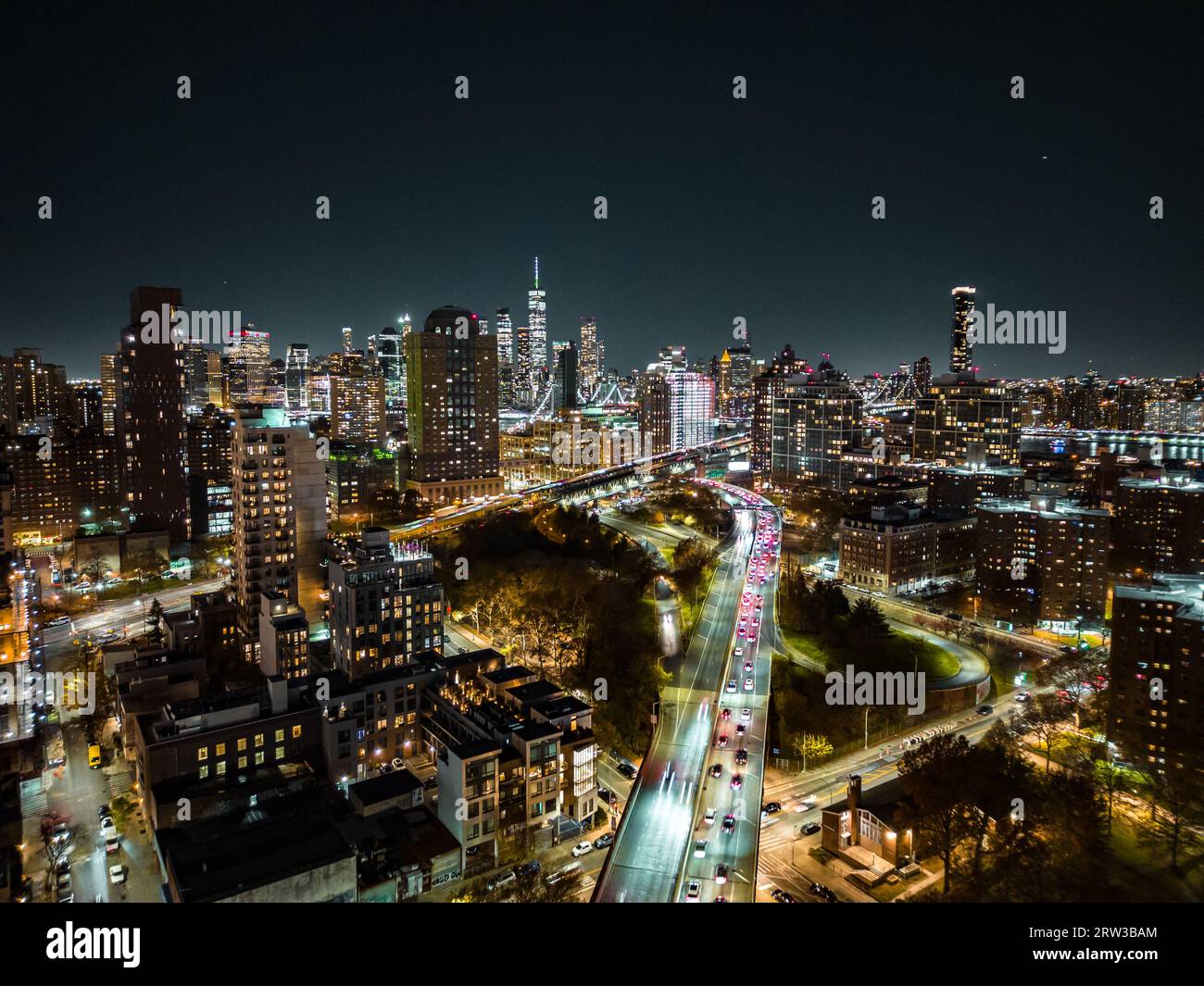 Aerial view of traffic on multilane expressway in night metropolis ...