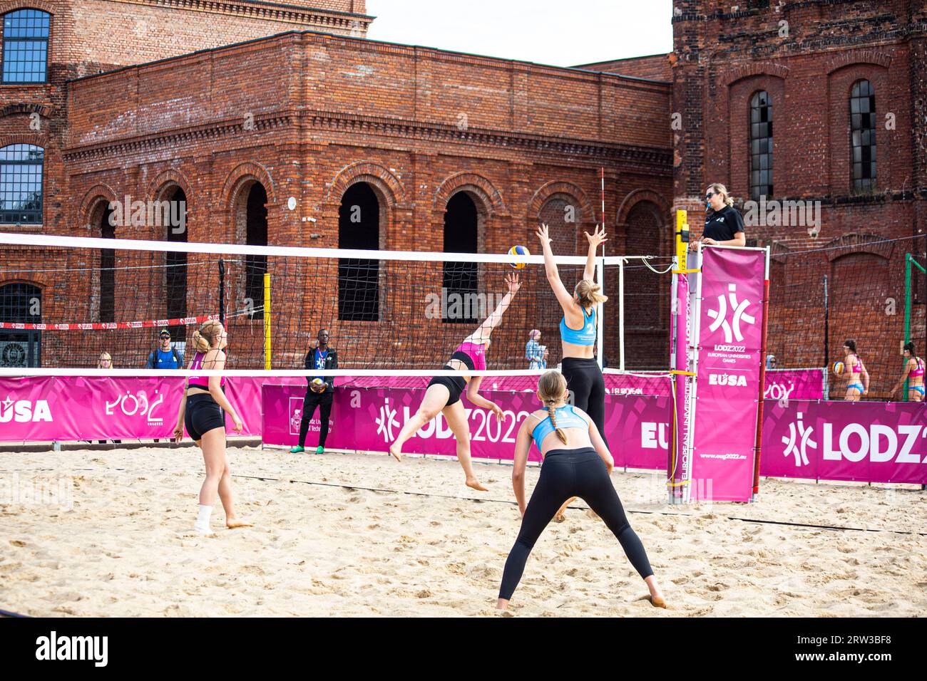 Ukrainian Sumy University beach volleyball team (blue tops and black ...