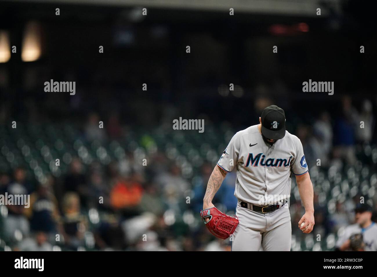 Miami Marlins' Tanner Scott pauses before pitching during the ninth ...