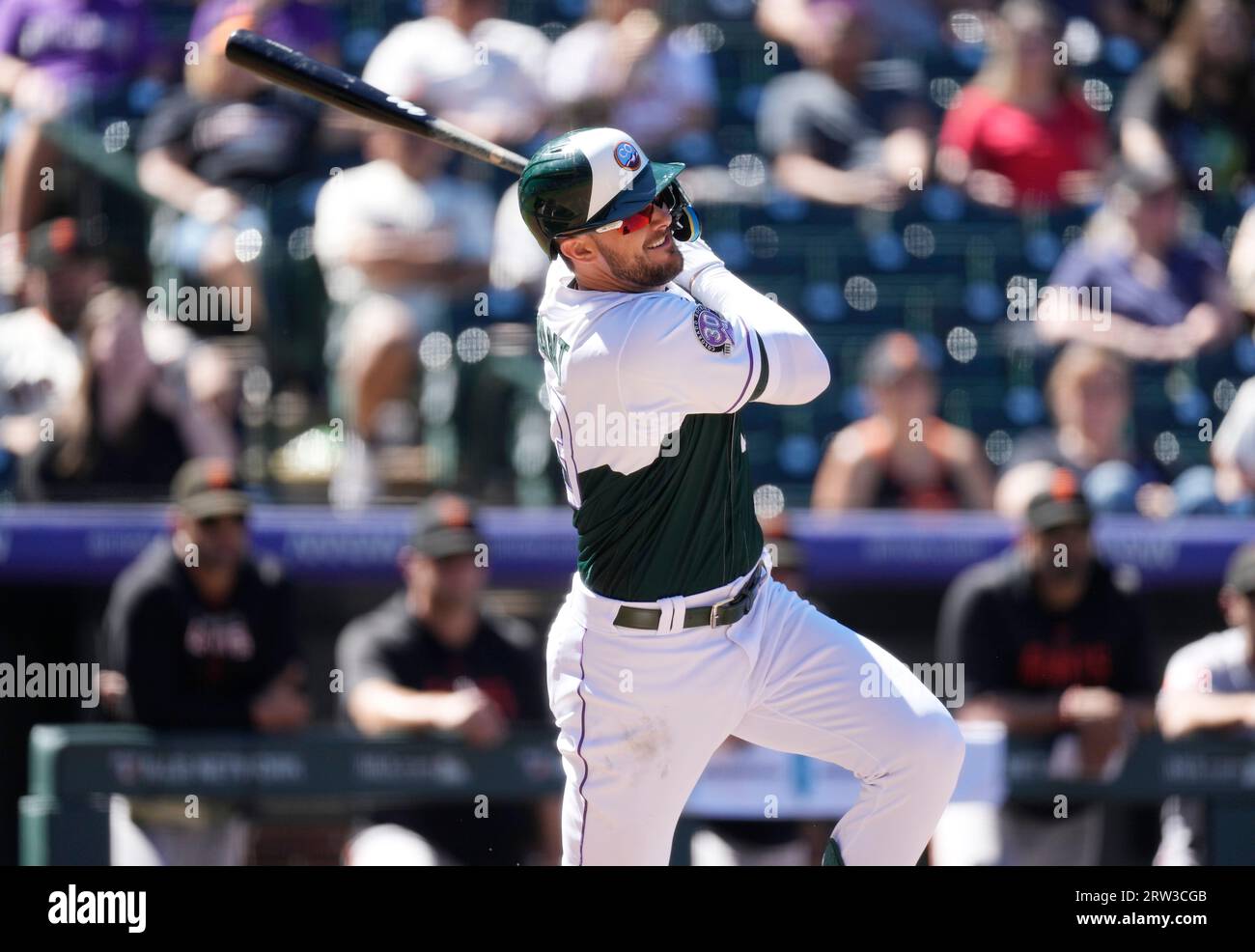 Colorado Rockies' Kris Bryant follows the flight of his RBI single off ...