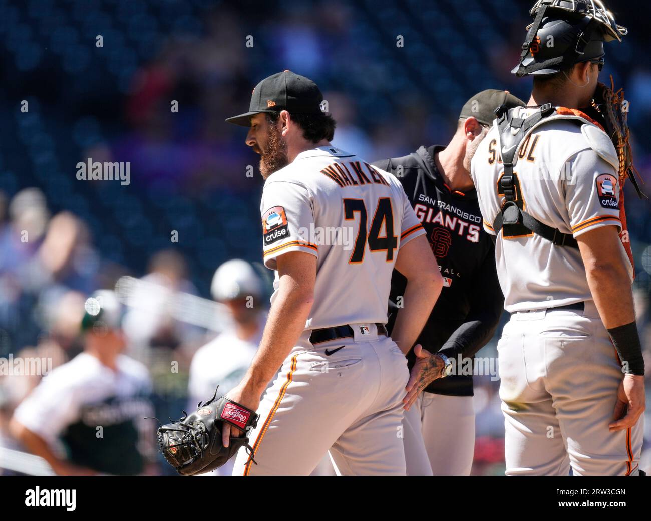 San Francisco Giants relief pitcher Ryan Walker, left, hands the ball ...