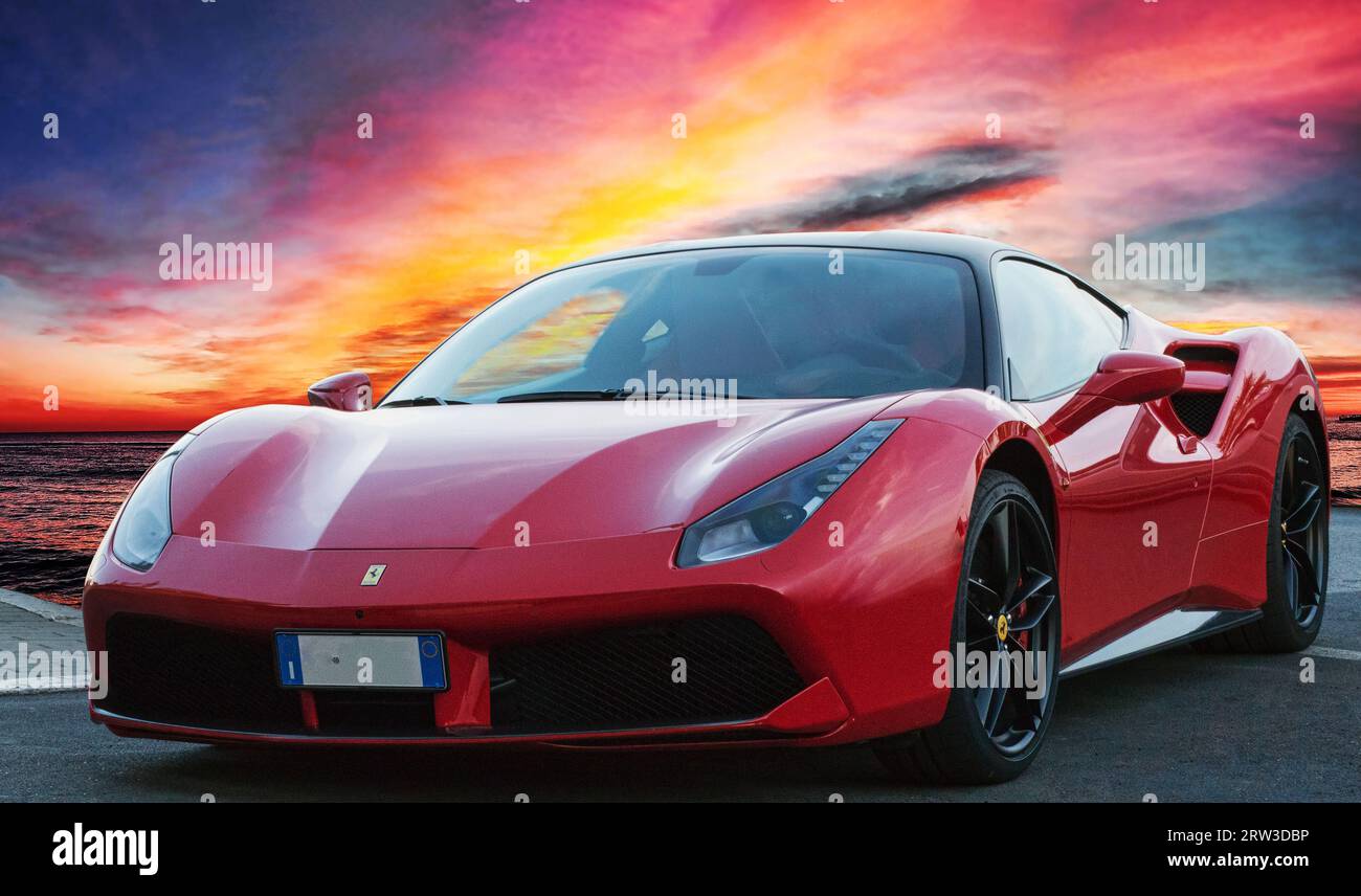 Luxury model fast sports car Ferrari 488 GTB placed on a scenic sunset ...