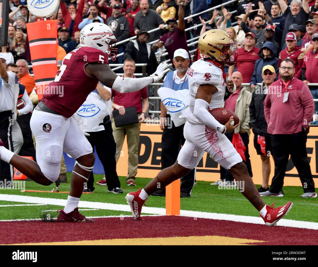 Boston College quarterback Thomas Castellanos (1) runs into the endzone ...