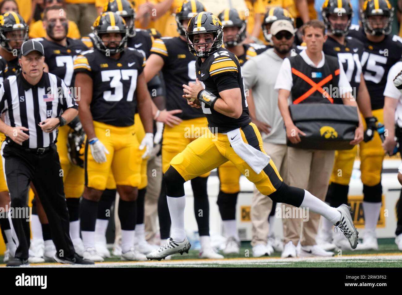 Iowa quarterback Cade McNamara (12) runs up field for a first down ...
